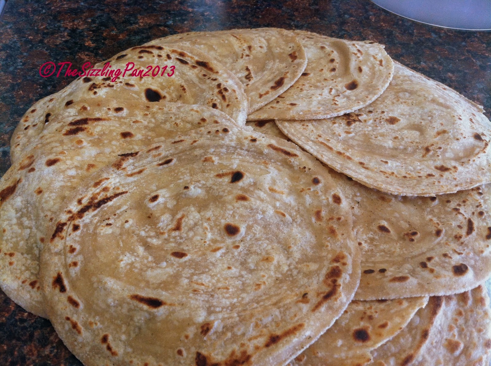 The Sizzling Pan: Laccha Paratha and Saag Paneer