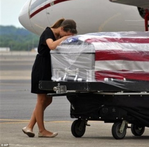 Wounded Times: Soldier's wife weeps over coffin at Smyrna Airport