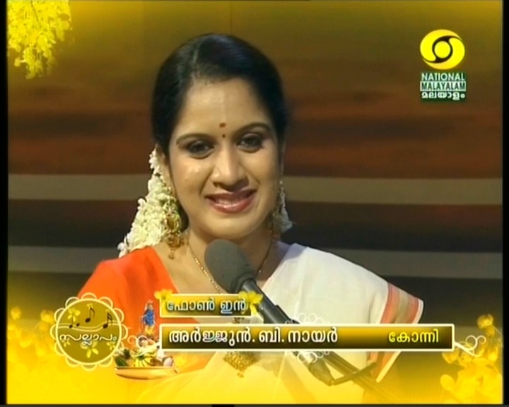 playback singer akhila anand in set saree cute images