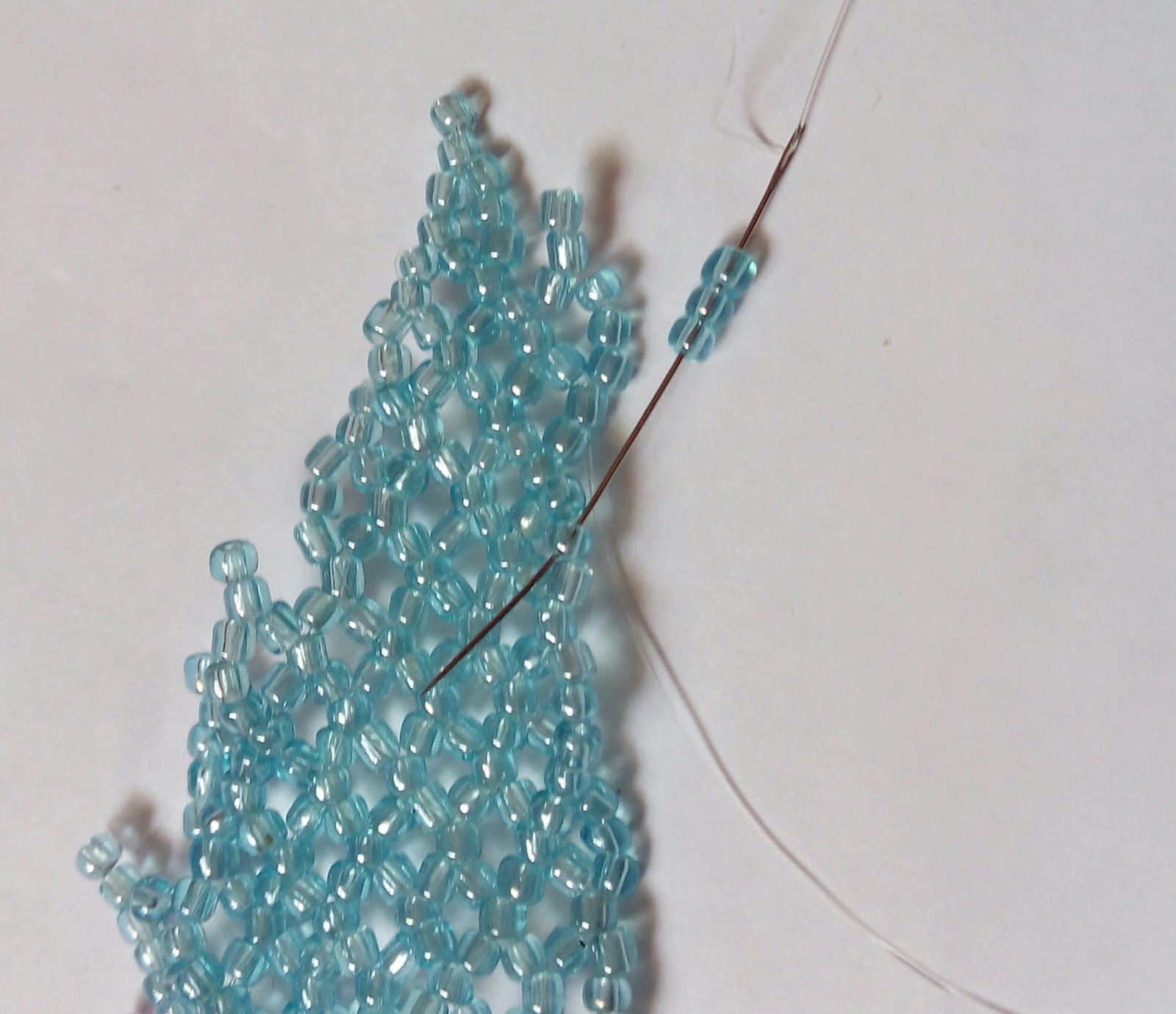 Beadination: Beautiful beaded flower using the bead netting technique.