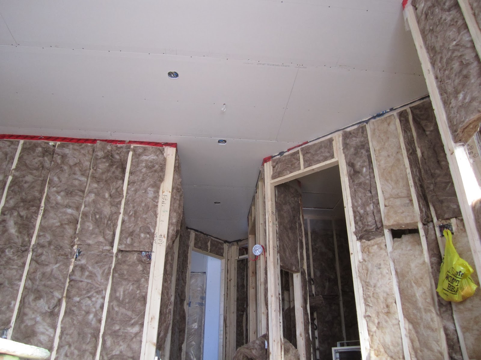 Building an infill in Westmount: Drywall has started!
