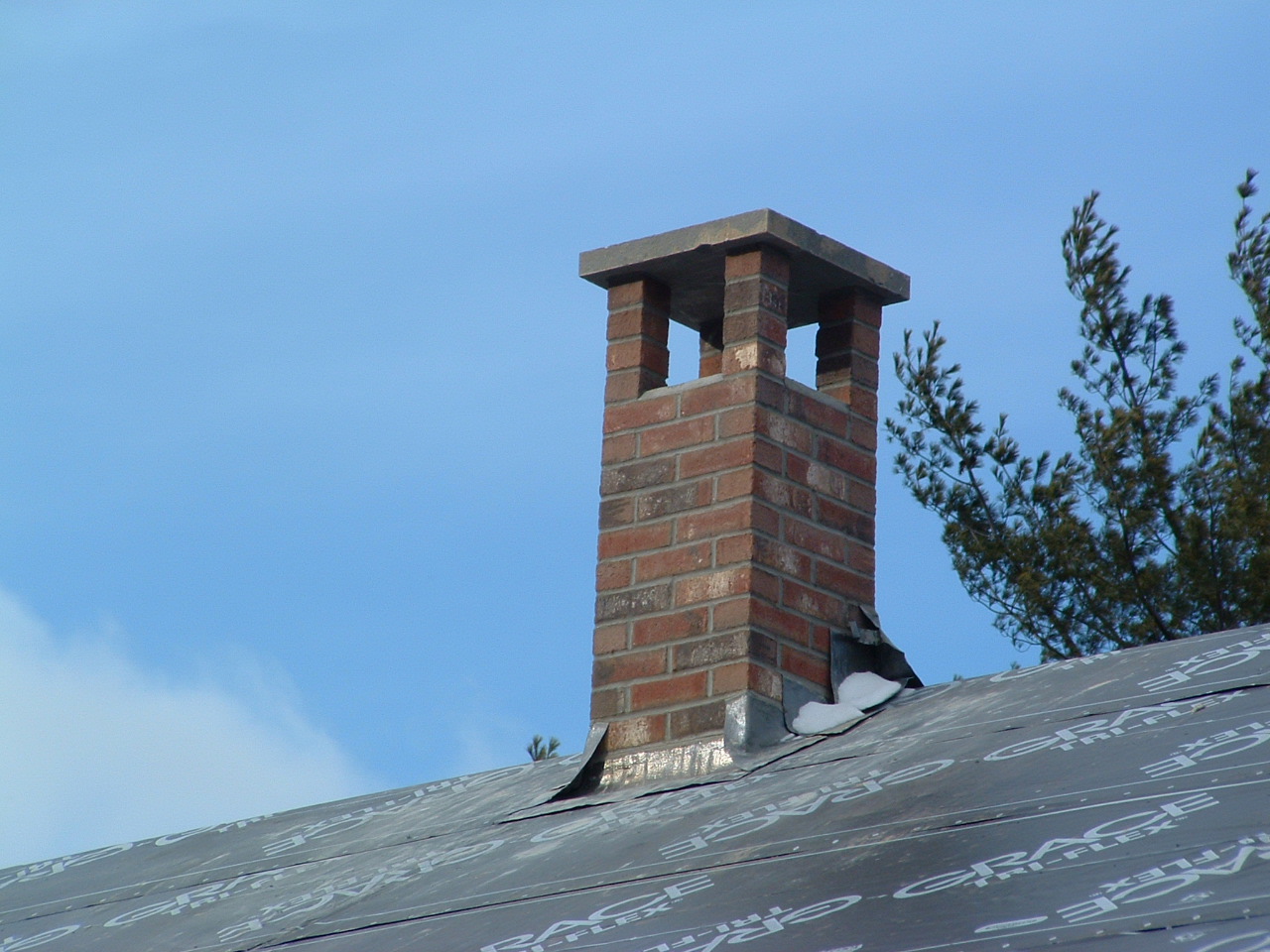 Hardwood Hermitage: Roof framed, chimney installed