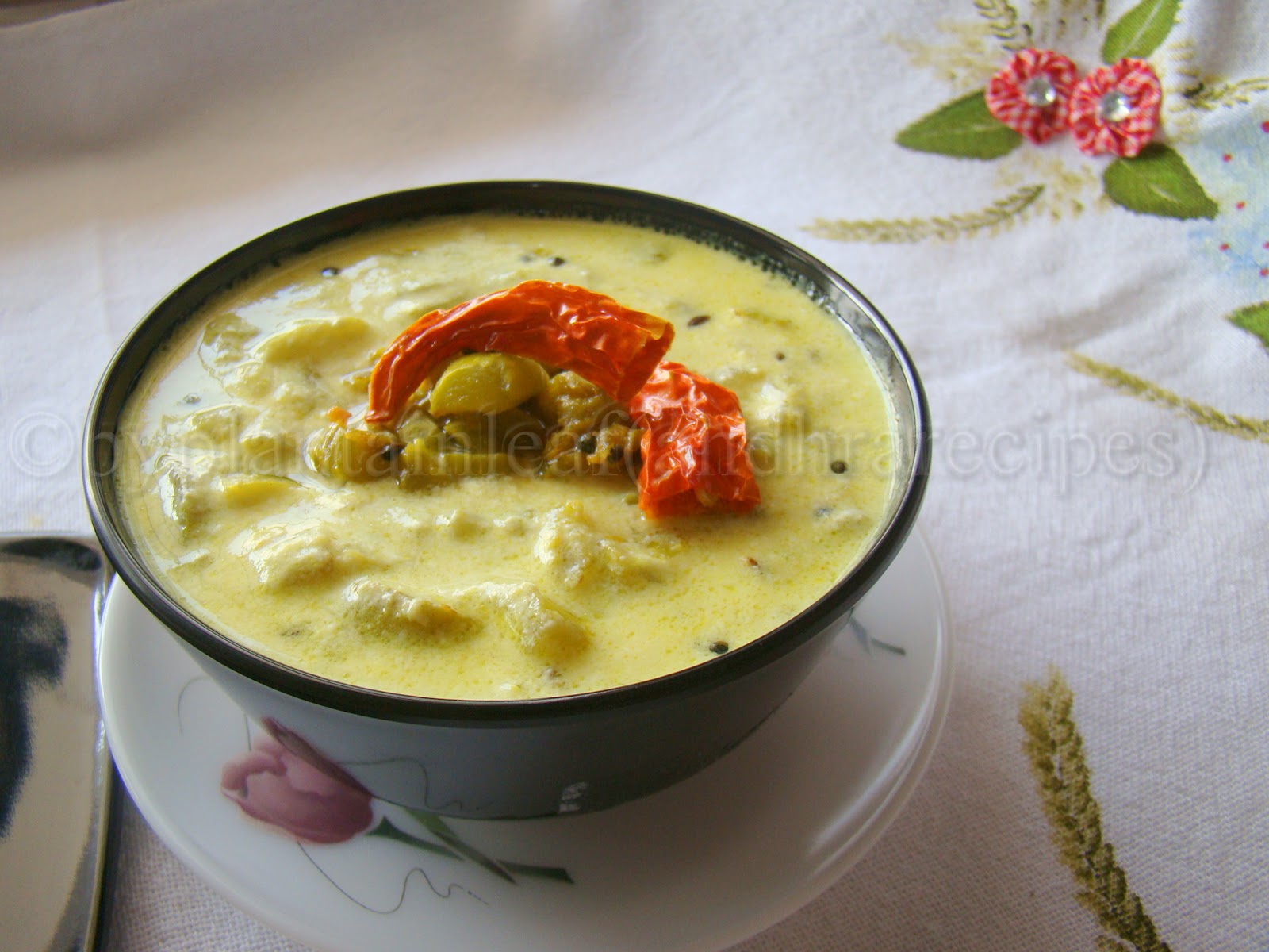 plantain leaf(Andhra Recipes): Potlakaya Perugu Pachadi (Snake Gourd raita)