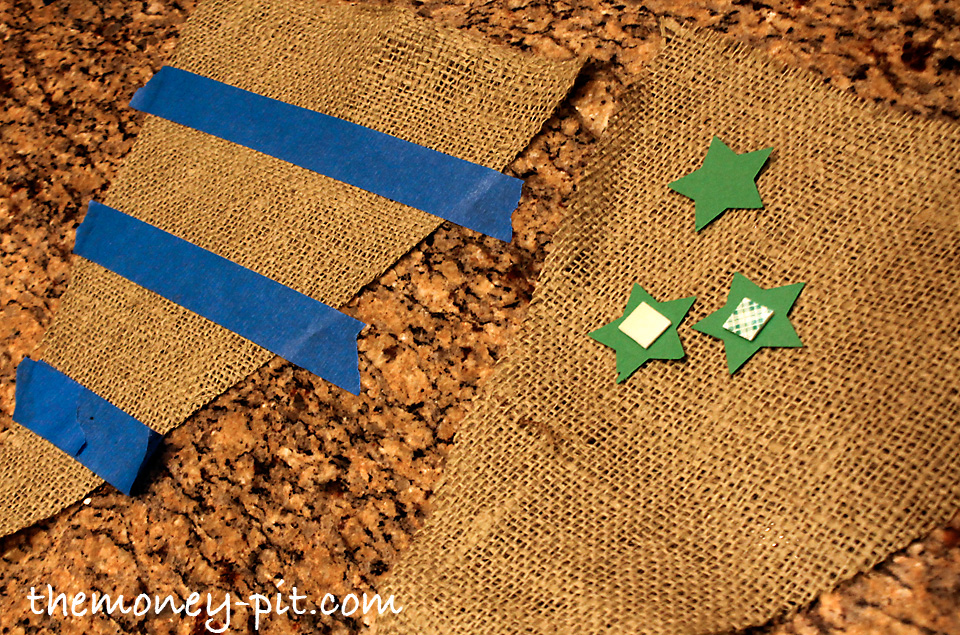 To keep the stars from sliding around while I painted over them, I ...