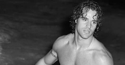 Hunksinswimsuits: Model at the beach in his speedos