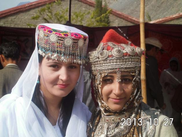 Girls of Gilgit-Biltistan wearing traditional caps at an event