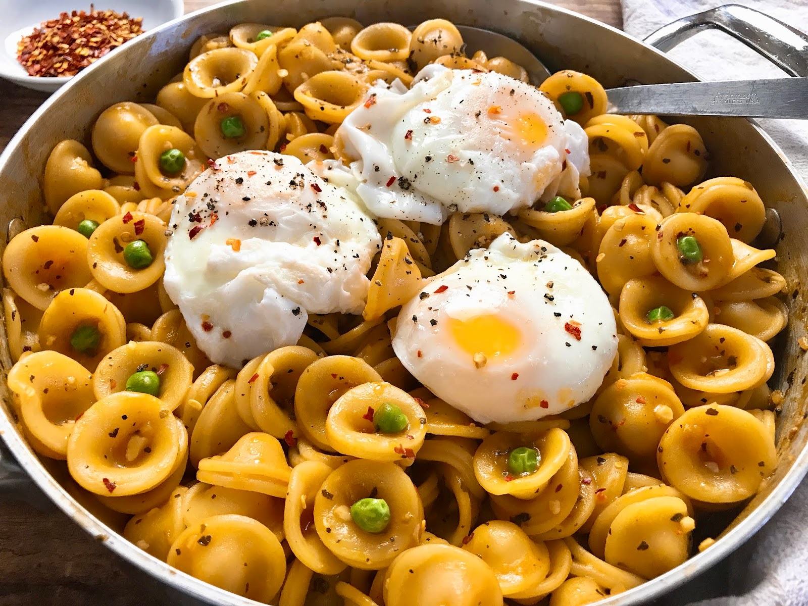 Orecchiette with Pea Pearls, Parmesan Rind and Poached Egg