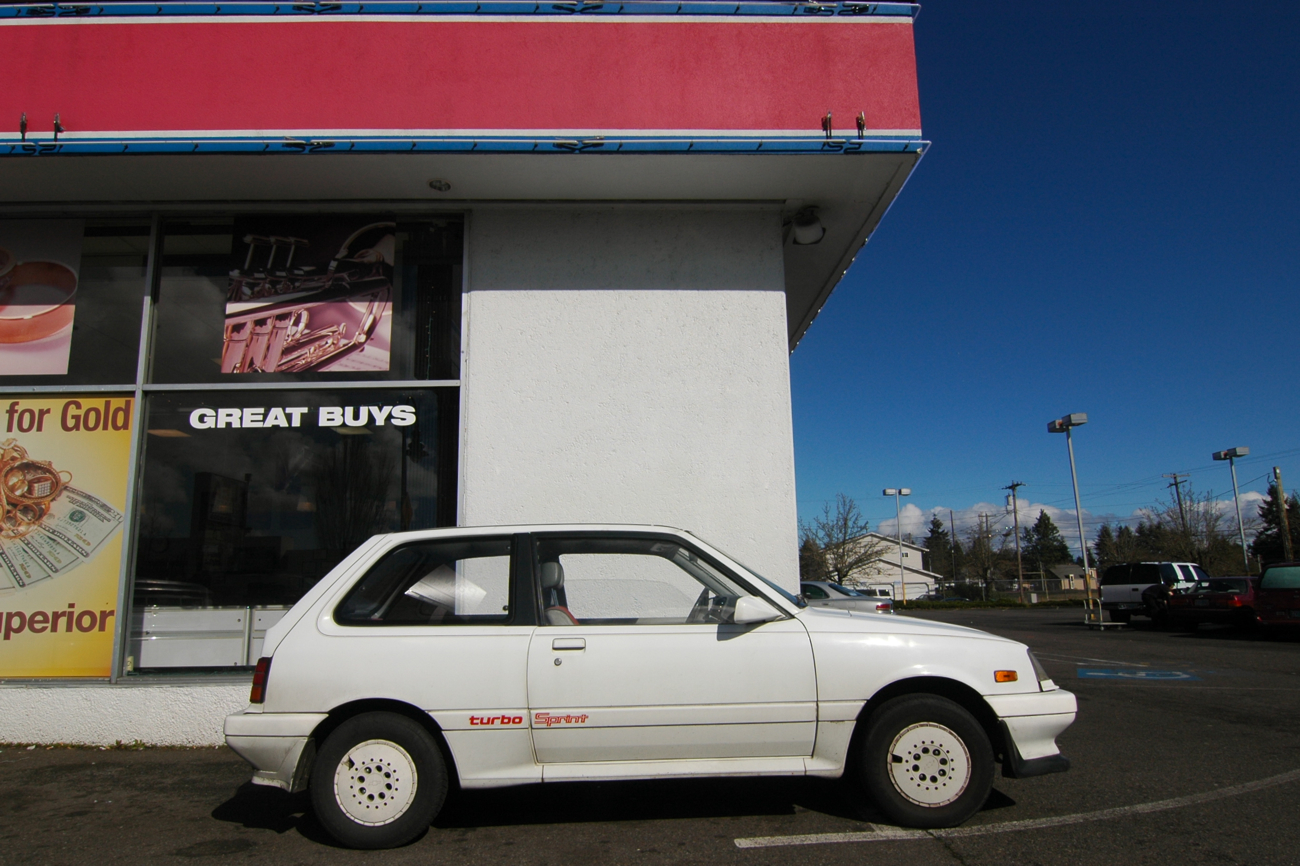 OLD PARKED CARS.: 1987 Chevy Turbo Sprint.