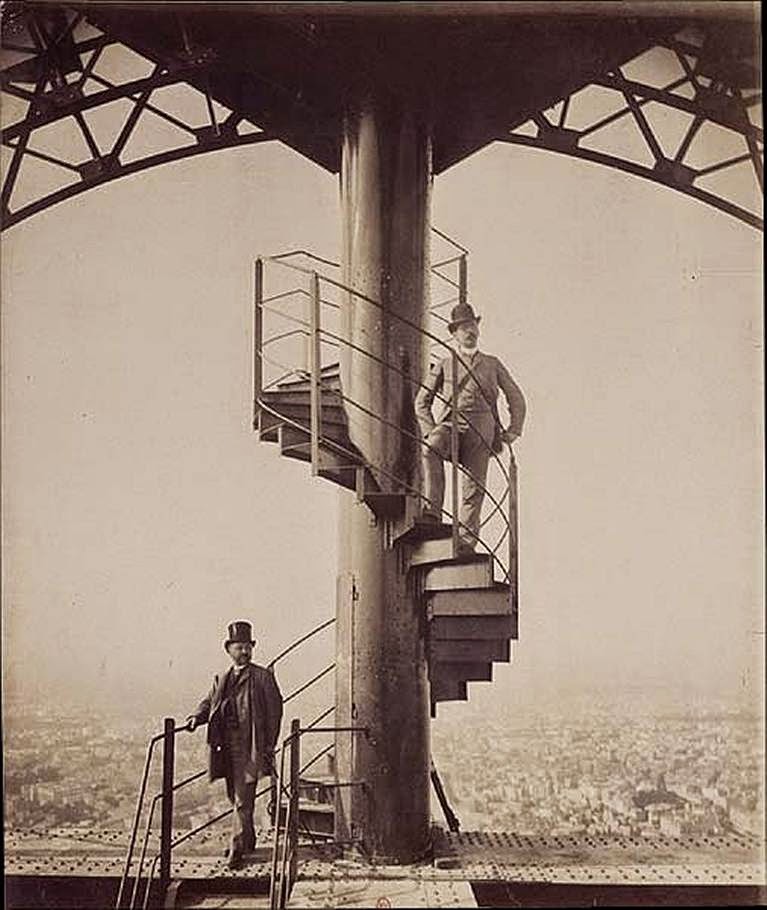 Alexandre Gustave Eiffel poses high on top of the completed Eiffel ...