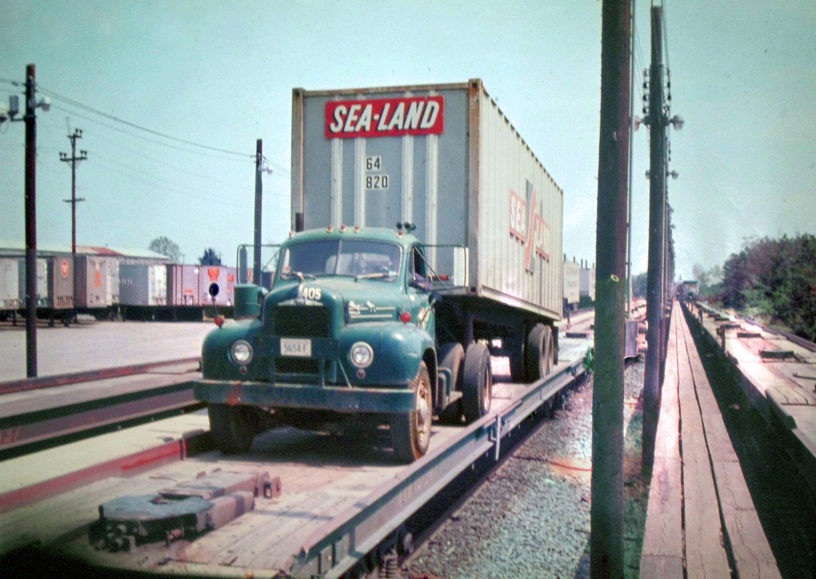 transpress nz: Mack truck and trailer on a flat car, Charlotte, North ...