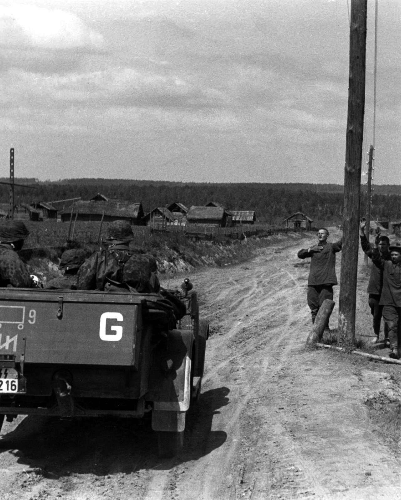 Men of Wehrmacht: SS Car Passing Russian POWs