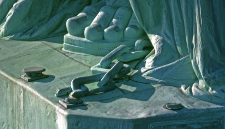 US Slave: Broken Chains and Shackles On The Statue Of Liberty