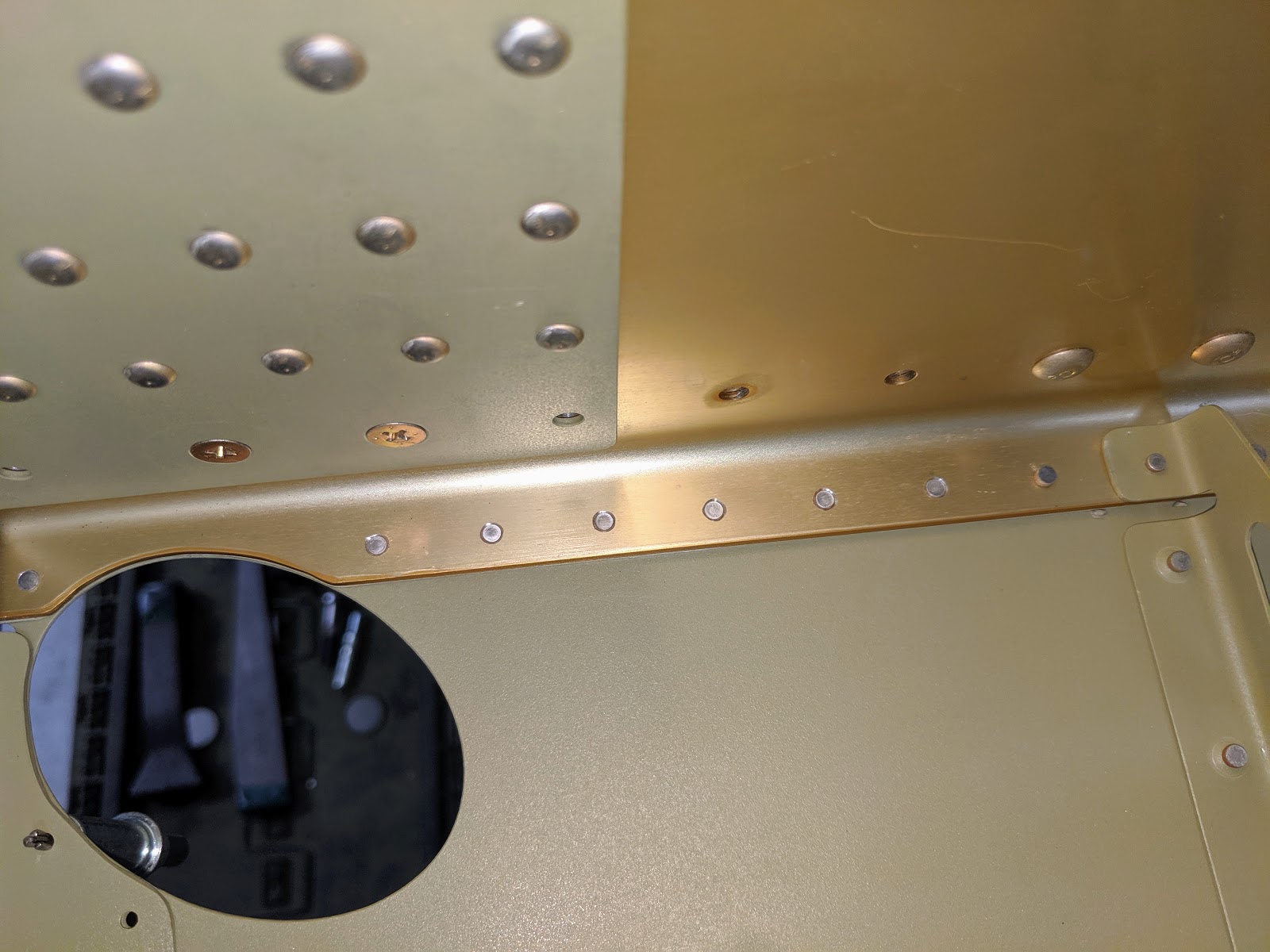 Damazio family's RV-10 project: Forward fuselage bottom skins riveted