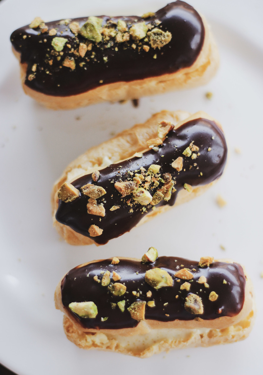Chocolate Pistachio Eclairs - Confessions of a Confectionista