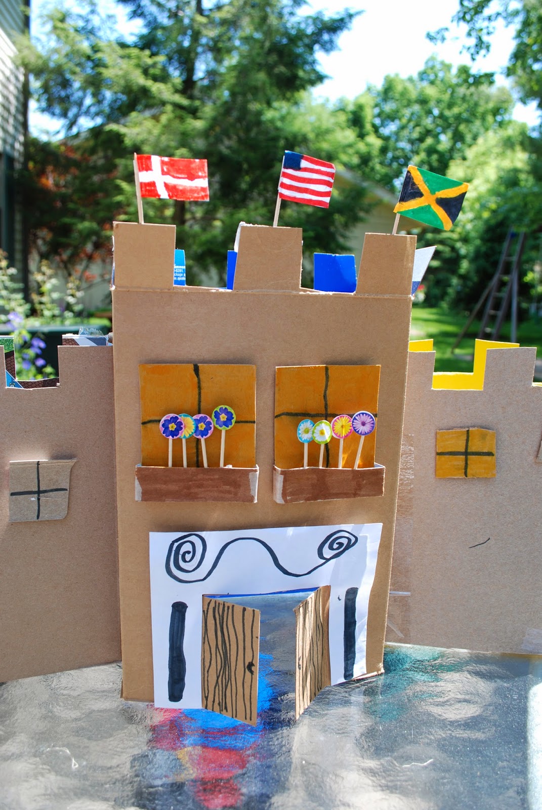 Home with Lindsay: Making a cardboard castle with mini flags.