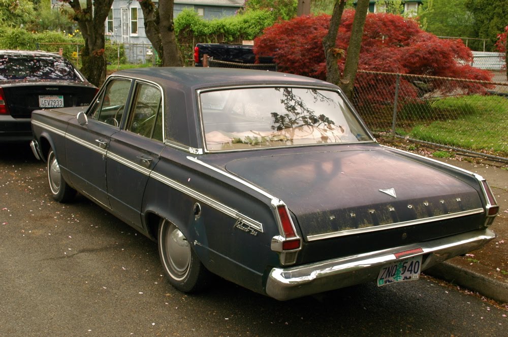 OLD PARKED CARS.: 1966 Plymouth Valiant 200 Sedan.