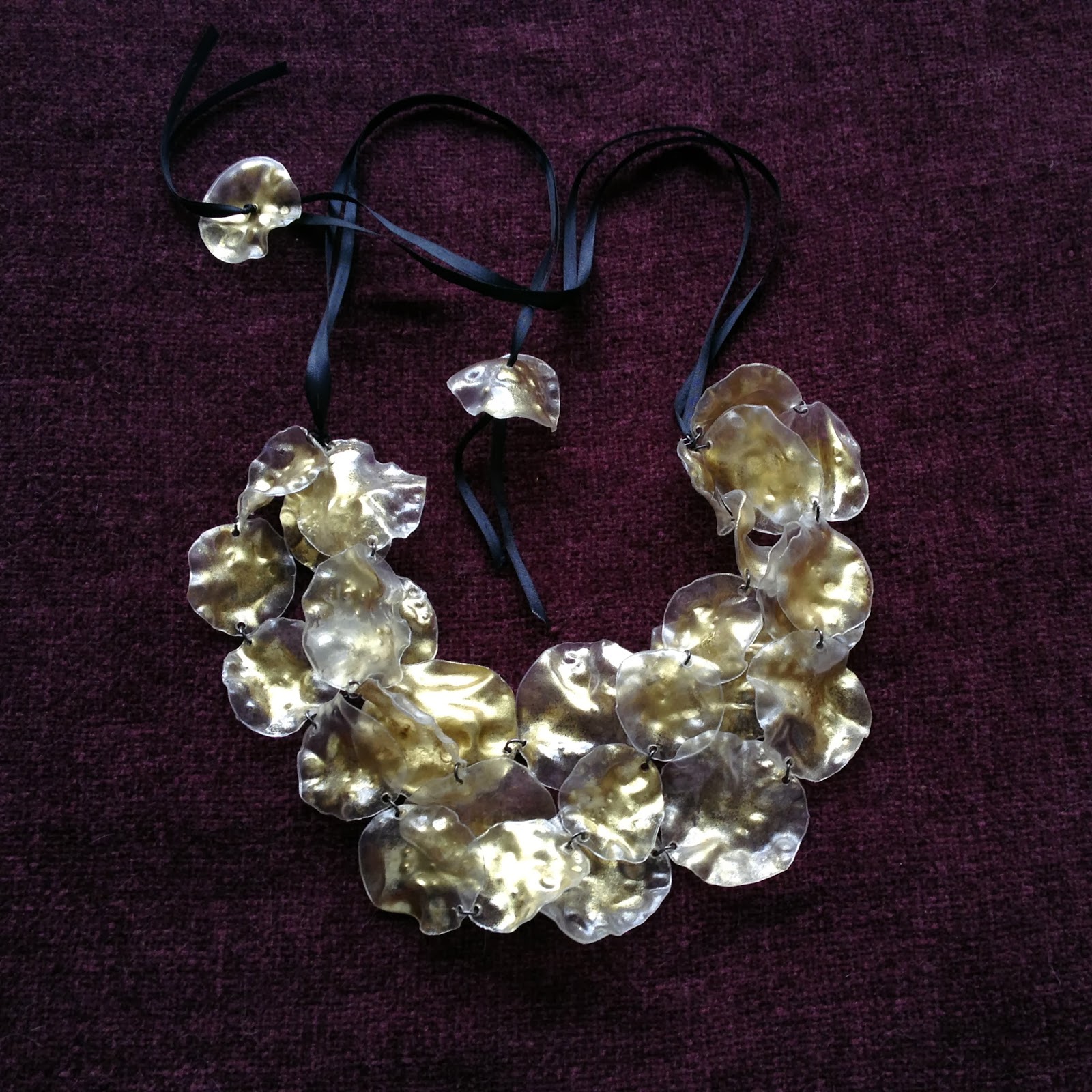 tertium non data: plastic; new gold necklaces