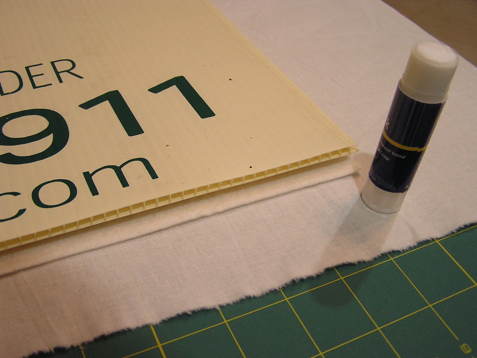 Stitchin' Therapy: Recycle those signs again and update.