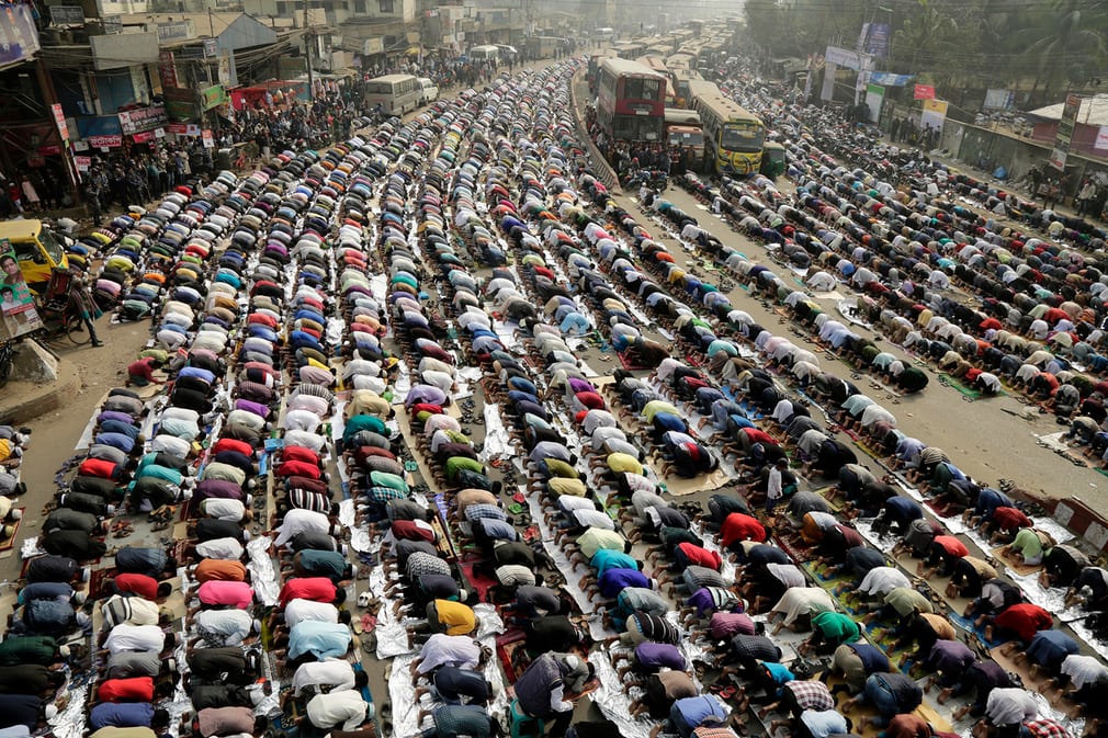 Muslims from around the world attend Friday prayers in the streets ...