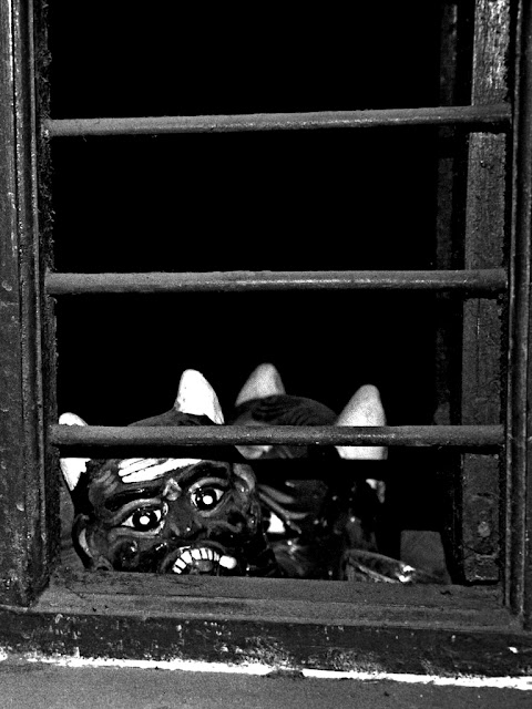 Ocean of Maya: Demon (Rakshas) heads in a window