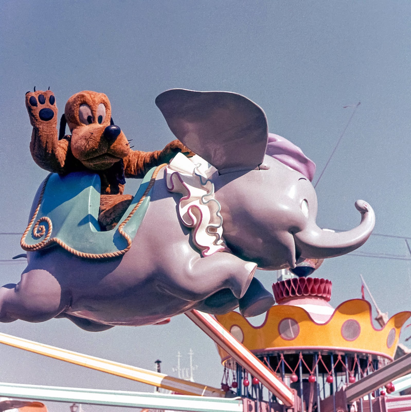 MickeyPhotos: Pluto riding the Dumbo ride at Disneyland in the early 60's