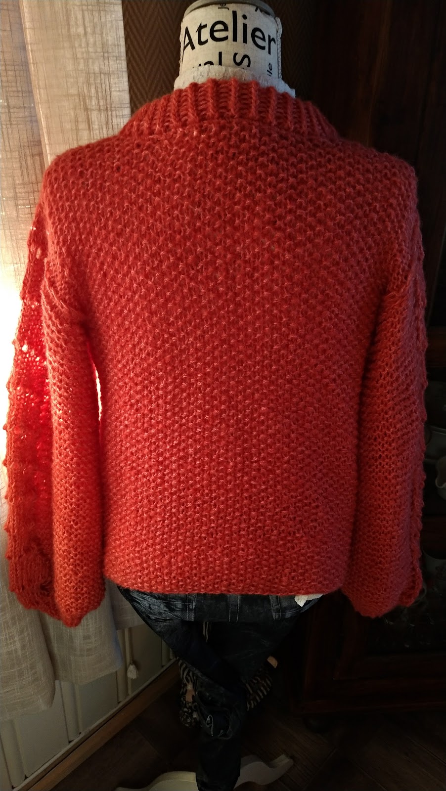 Ganni genser i korall farge