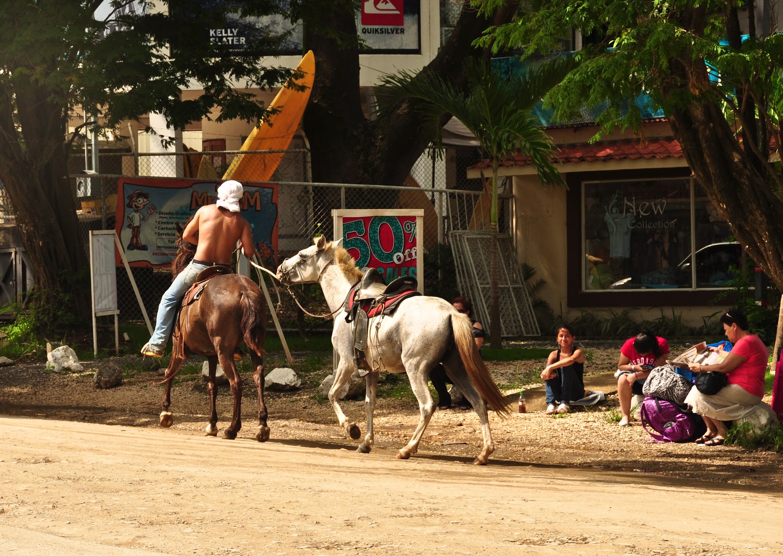 Tamarindo, Costa Rica Daily Photo: The rider and horses scurry off