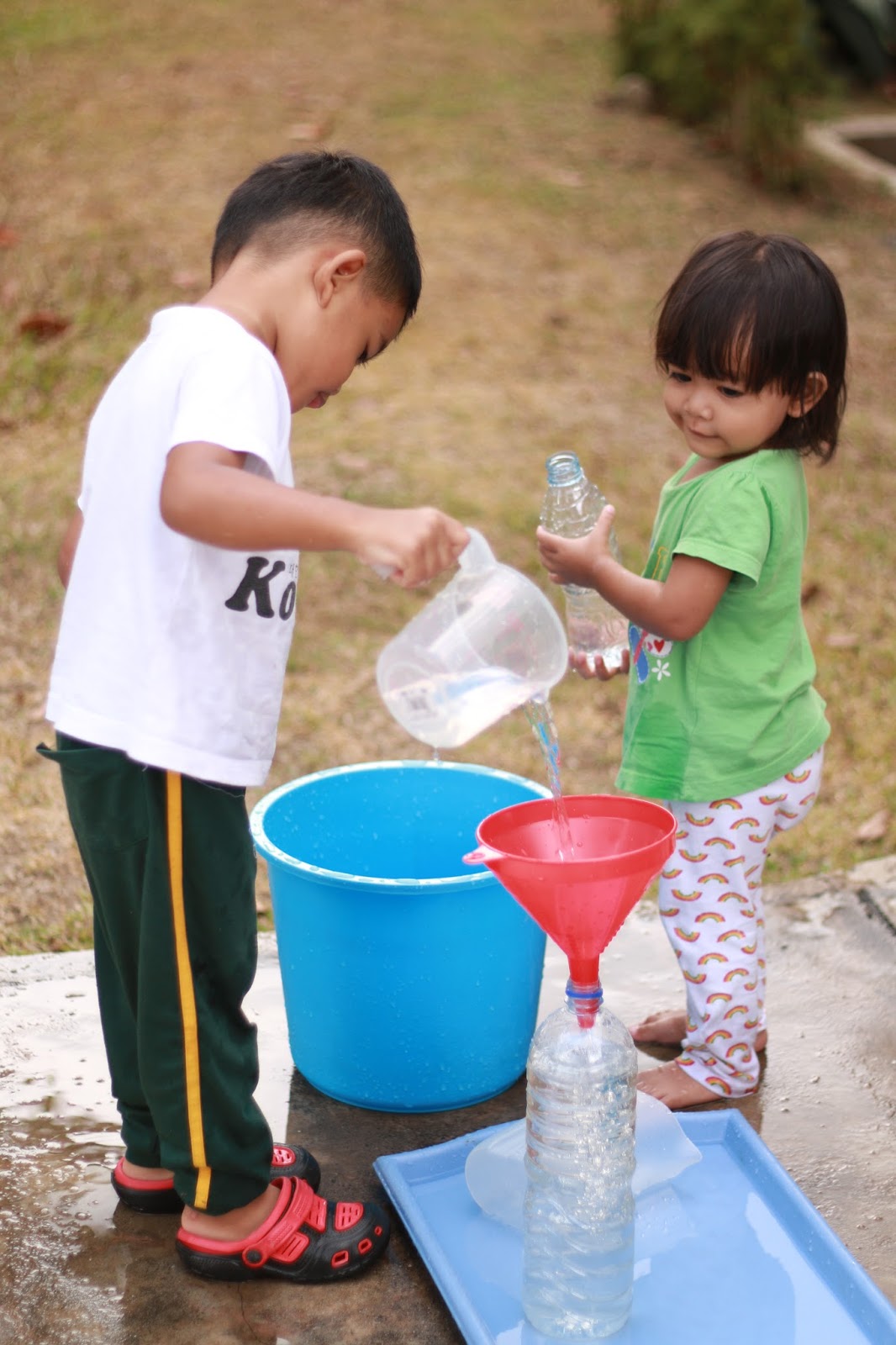 Montessori: Pouring Water Through Funnel Activity | My Home My School