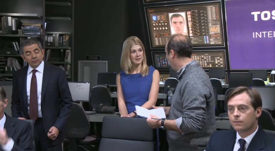 Watch a 'Johnny English Reborn' featurette and a new still of Rosamund Pike