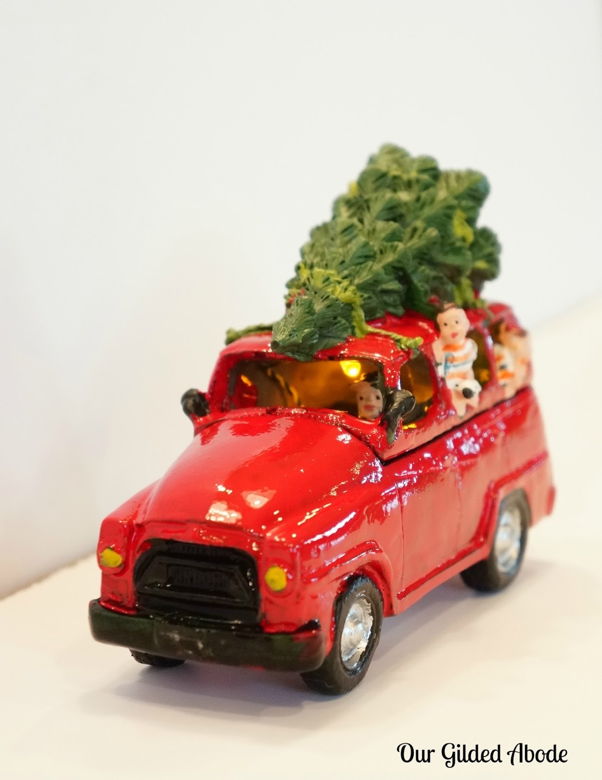 Our Gilded Abode: Making Your Own Red Vehicle with Tree Decor