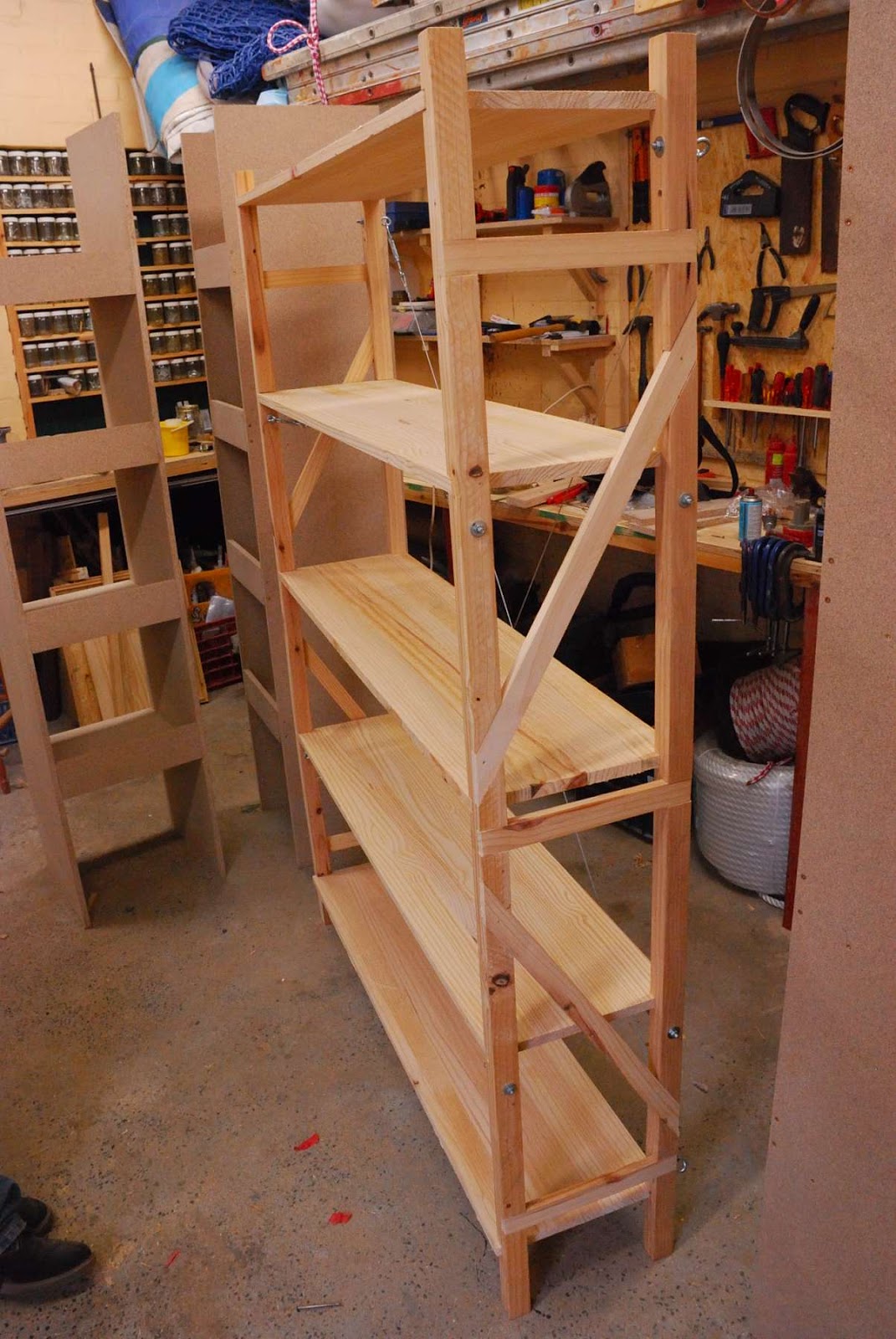 The bookcase is held together as an assembly with cables and turn ...