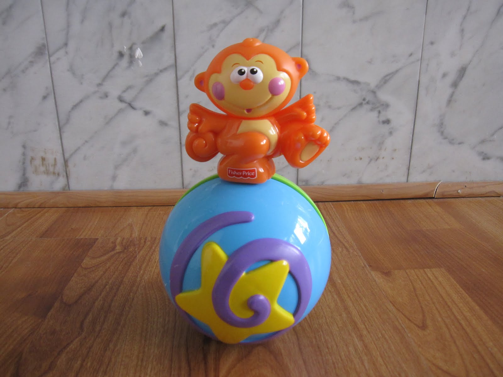 MOVING SALE - BABY GEAR/TOYS: FISHER PRICE CRAWL ALONG MUSICAL BALL - $8
