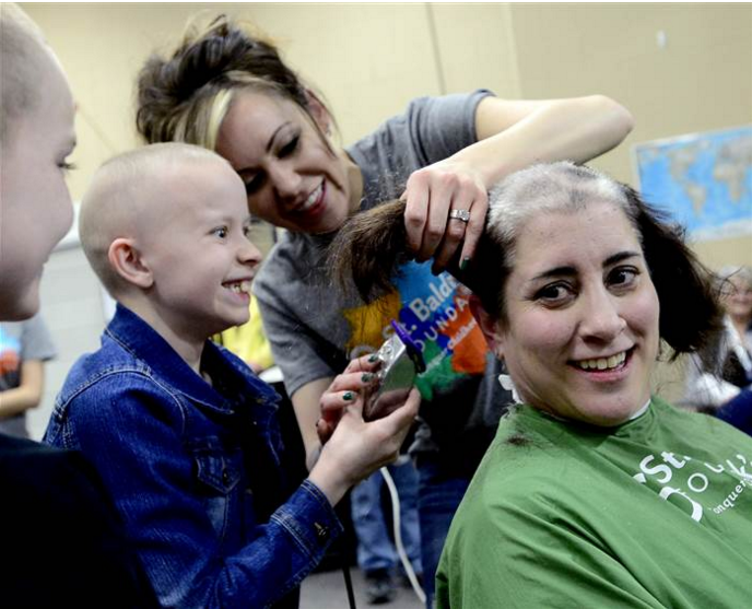 80 students shave heads to support classmate with cancer returning to ...