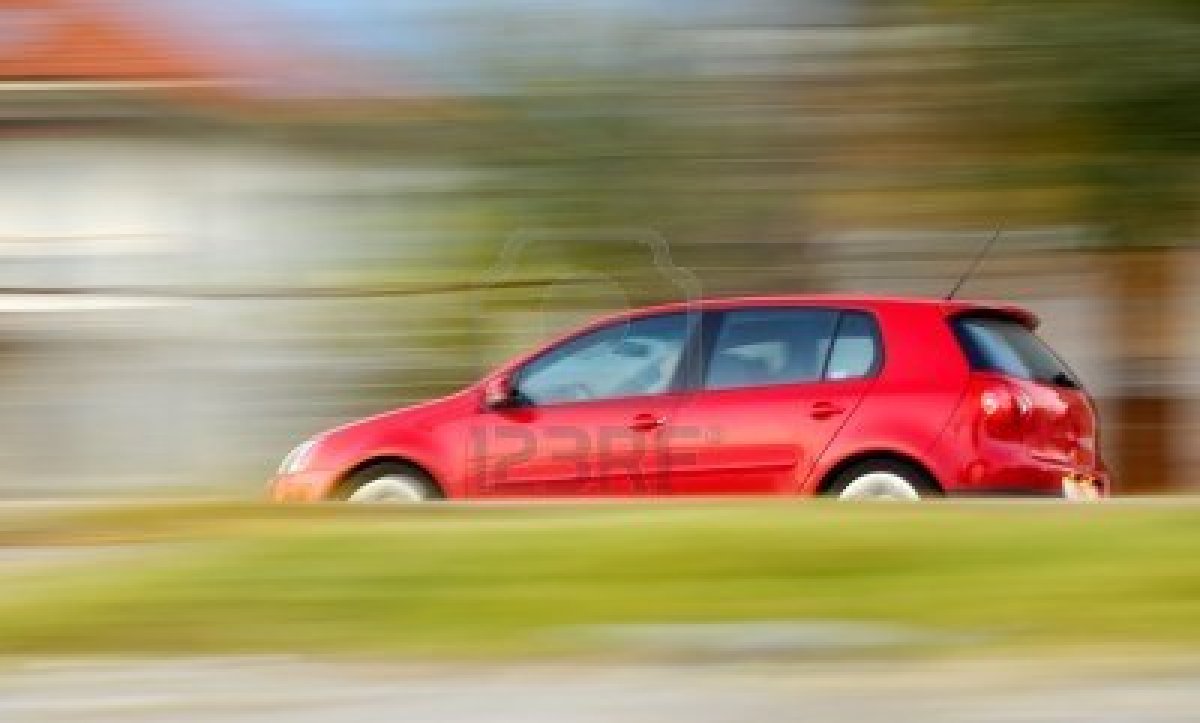 Panning Shot of a Fast Moving Red Car Photograph | (Photos Area