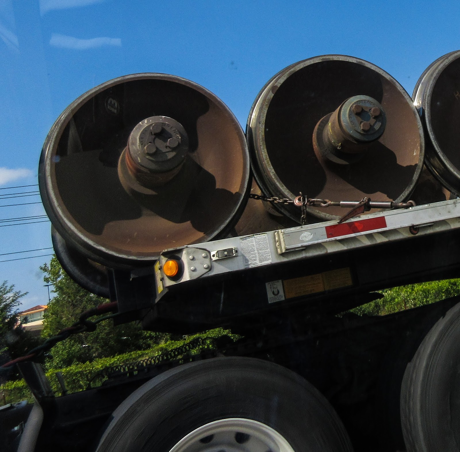 Images from my peripatetic life: Train axles in transit, Ohio