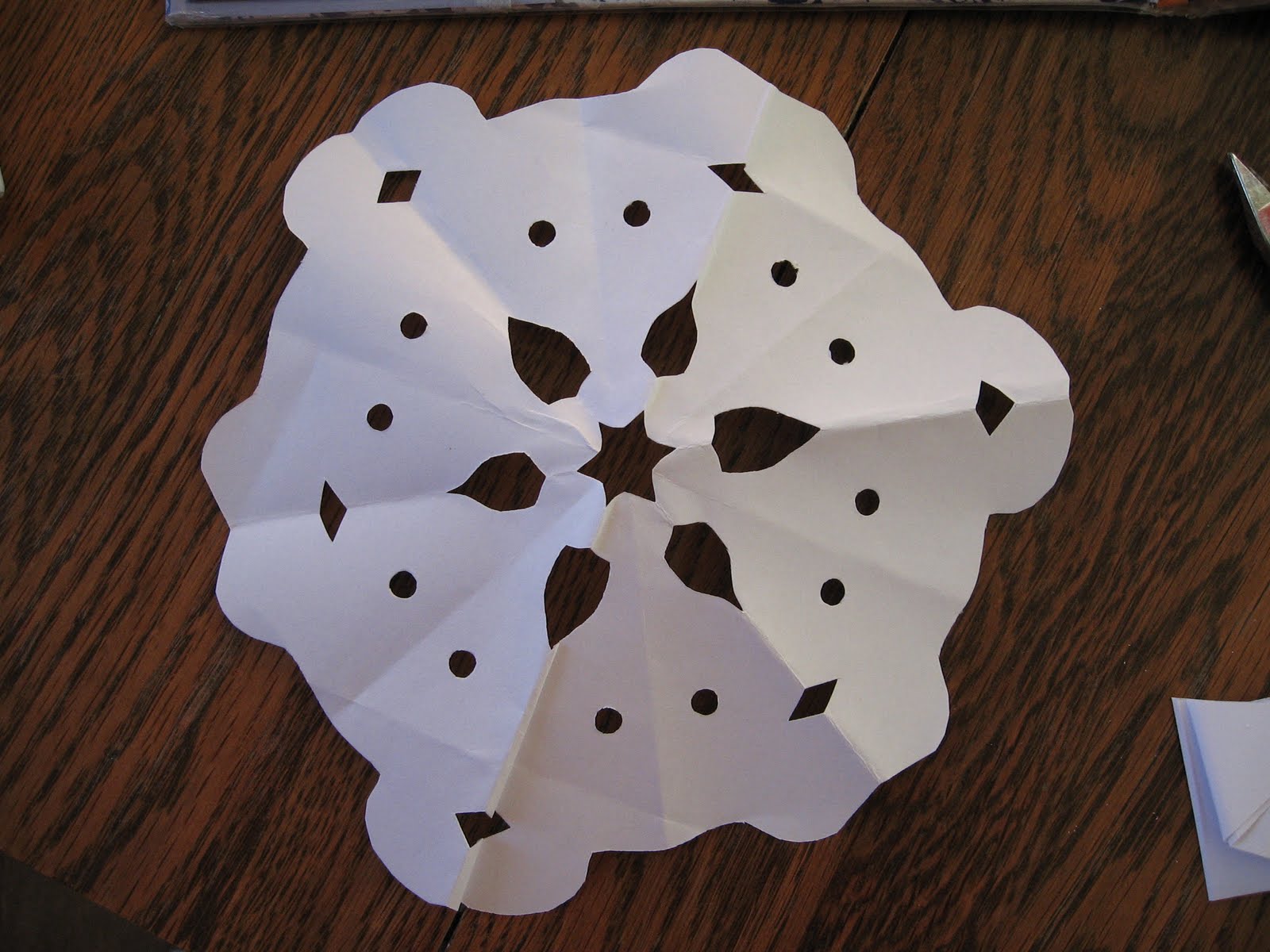 Almost Unschoolers: Snowflake Paper Dolls and a Snowman Mosaic