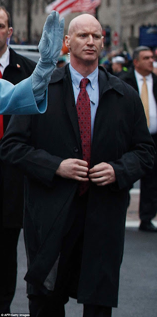 Online commenters have pointed to the way a bald, hulking US Secret ...