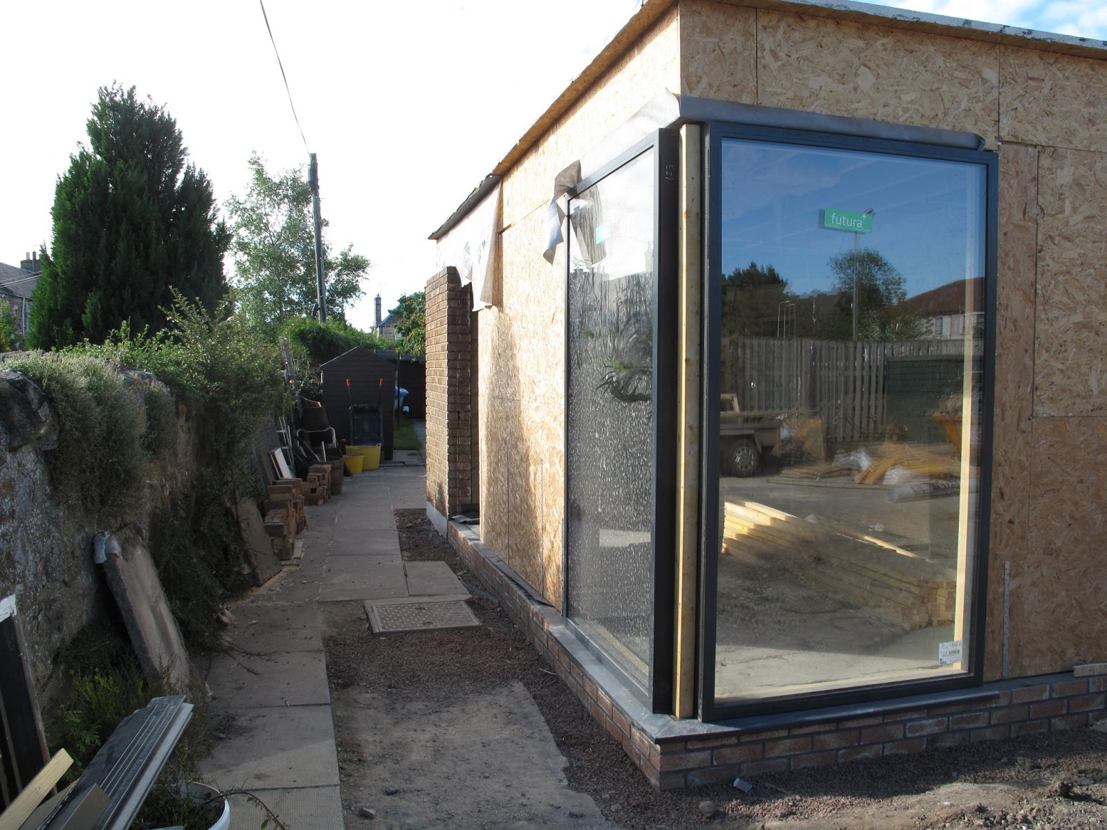 Modest Designs: OSB Cladding going up