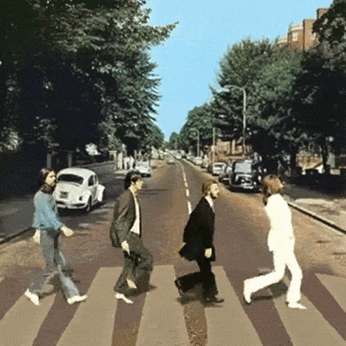 The Beatles walking silly on Abbey Road