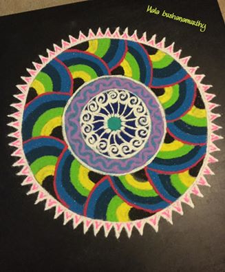 CHODAVARAMNET: SHANKH FLOWERS WITH BRIGHT WHEELS RANGOLI ART