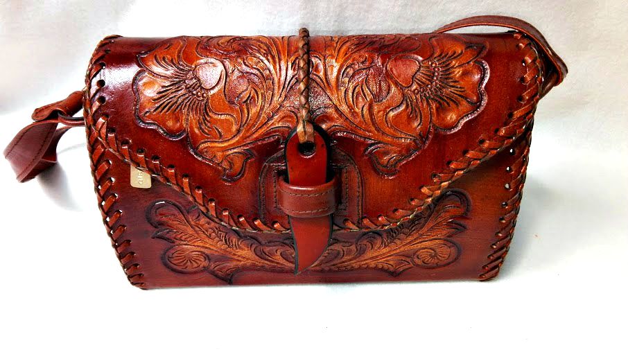 brandylovesvintage: vedasto: convertible tooled leather bag