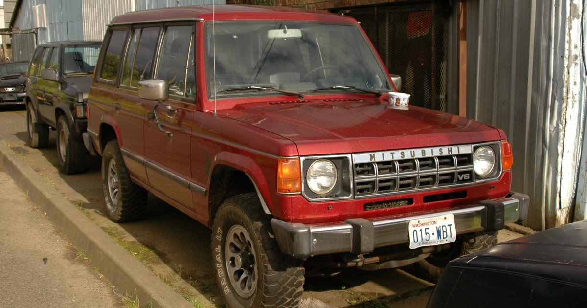 OLD PARKED CARS.: 1989 Mitsubishi Montero.