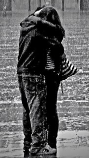 Couples Hugging In Rain