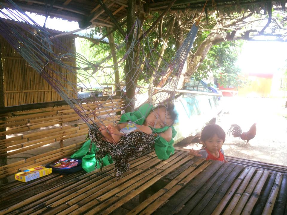 Kid napping on the island of Balicasag Philippines