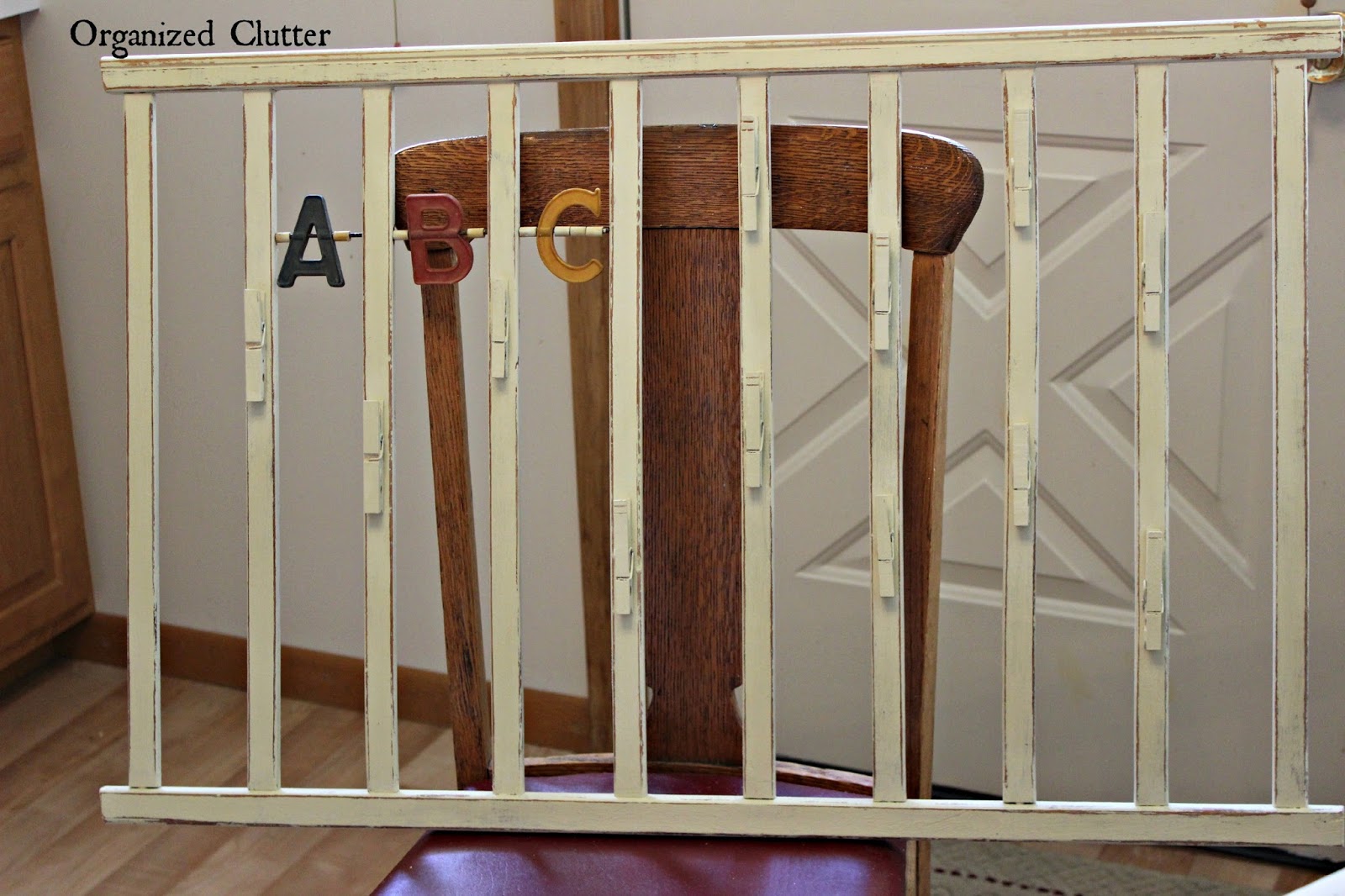 Re-Purposed Crib Rail Photo Display - Organized Clutter