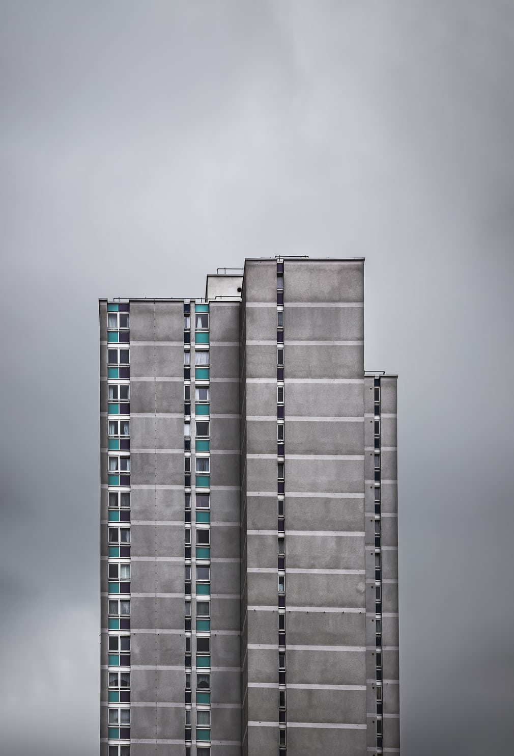 Grey concrete flats, generic office blocks, a grimly rising skyscraper