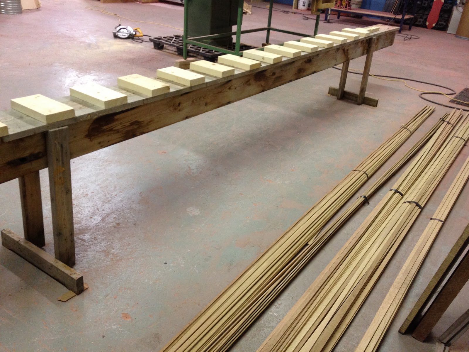 Building a cedar strip canoe: Setting up the form and the first strips.