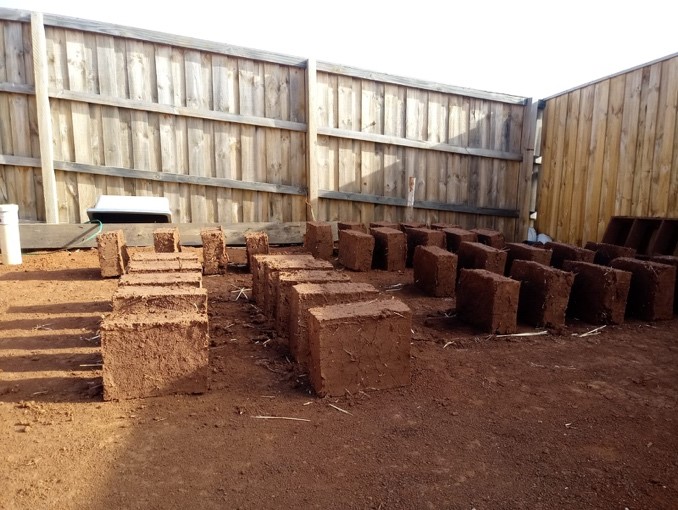 DRYING AND STORING MUD BRICKS