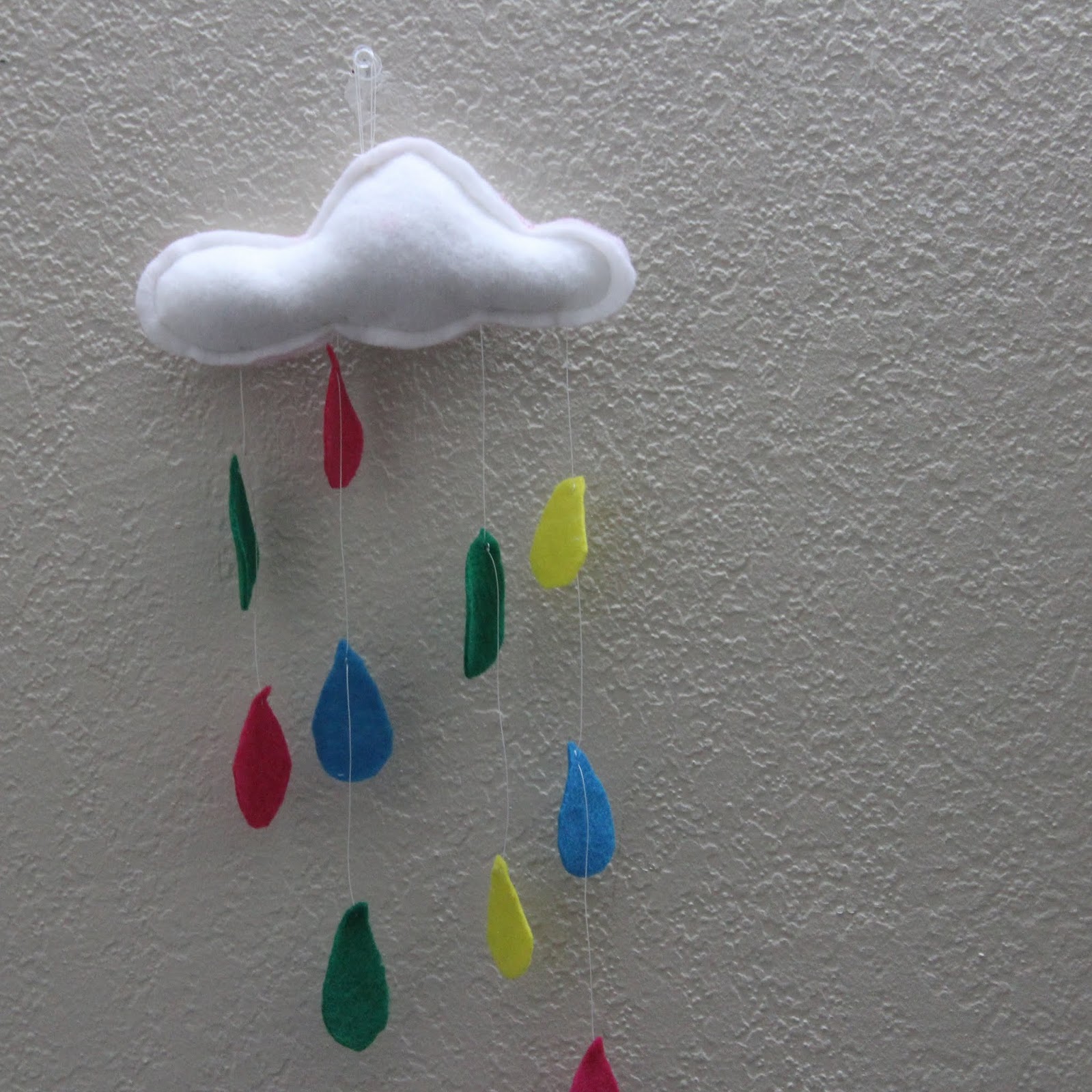 10. Thread a loop on the top of the cloud twice to hang the mobile. Its ...