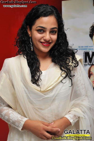 Nithya Menon Gorgeous in White Chudi Photo Gallery At Audio Launch of ...